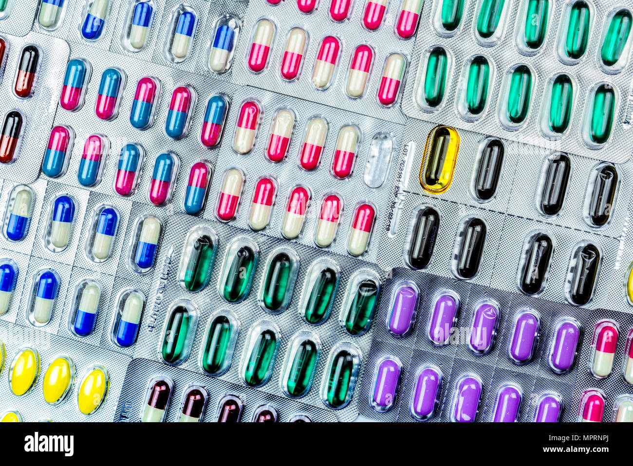 Colorful of tablets and capsules pill in blister packaging arranged ...