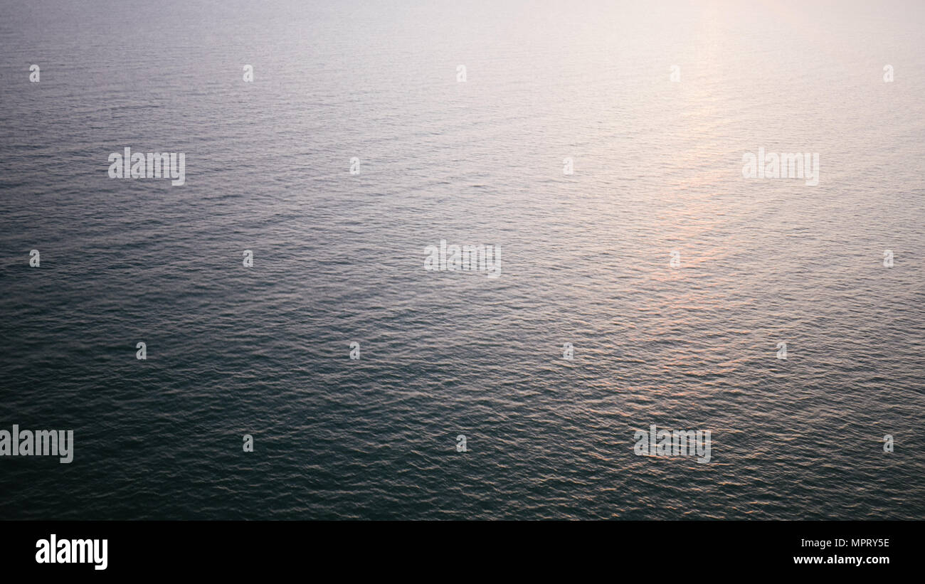Aerial view of Tirrenean sea in Tuscany,Italy, reflection at sunset ...