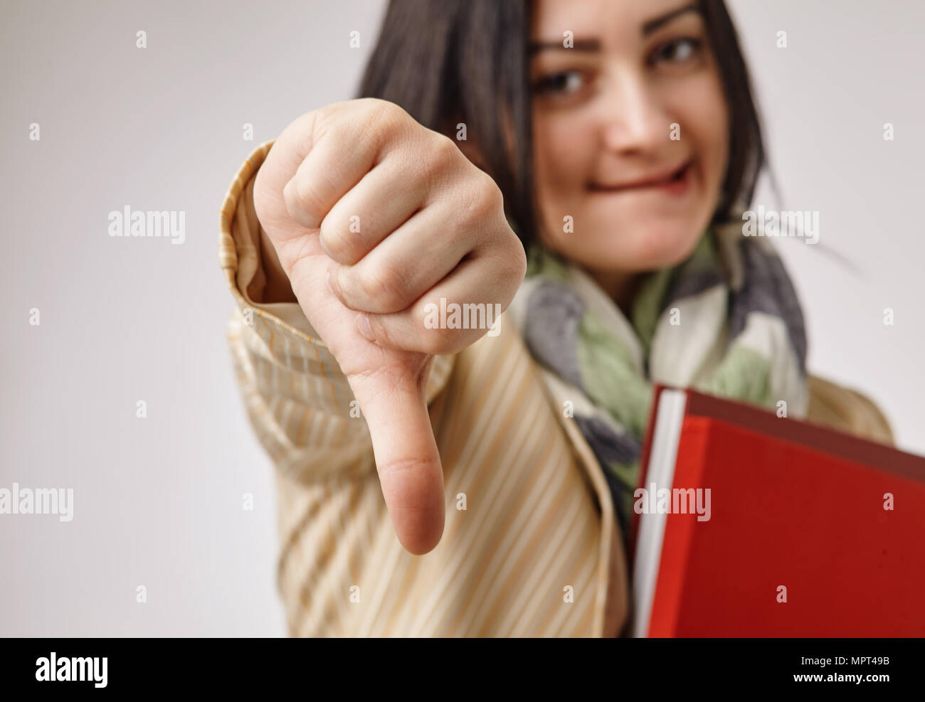 young business woman showing her finger down Stock Photo - Alamy