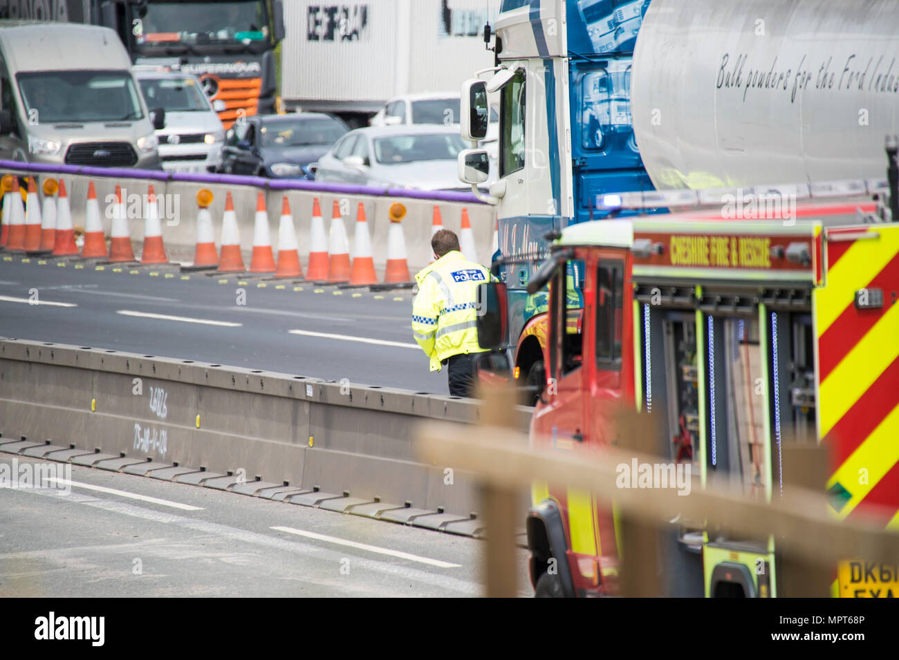 Four HGVs crash one man trapped fire service and ambulance crews trying to extracate him air ...
