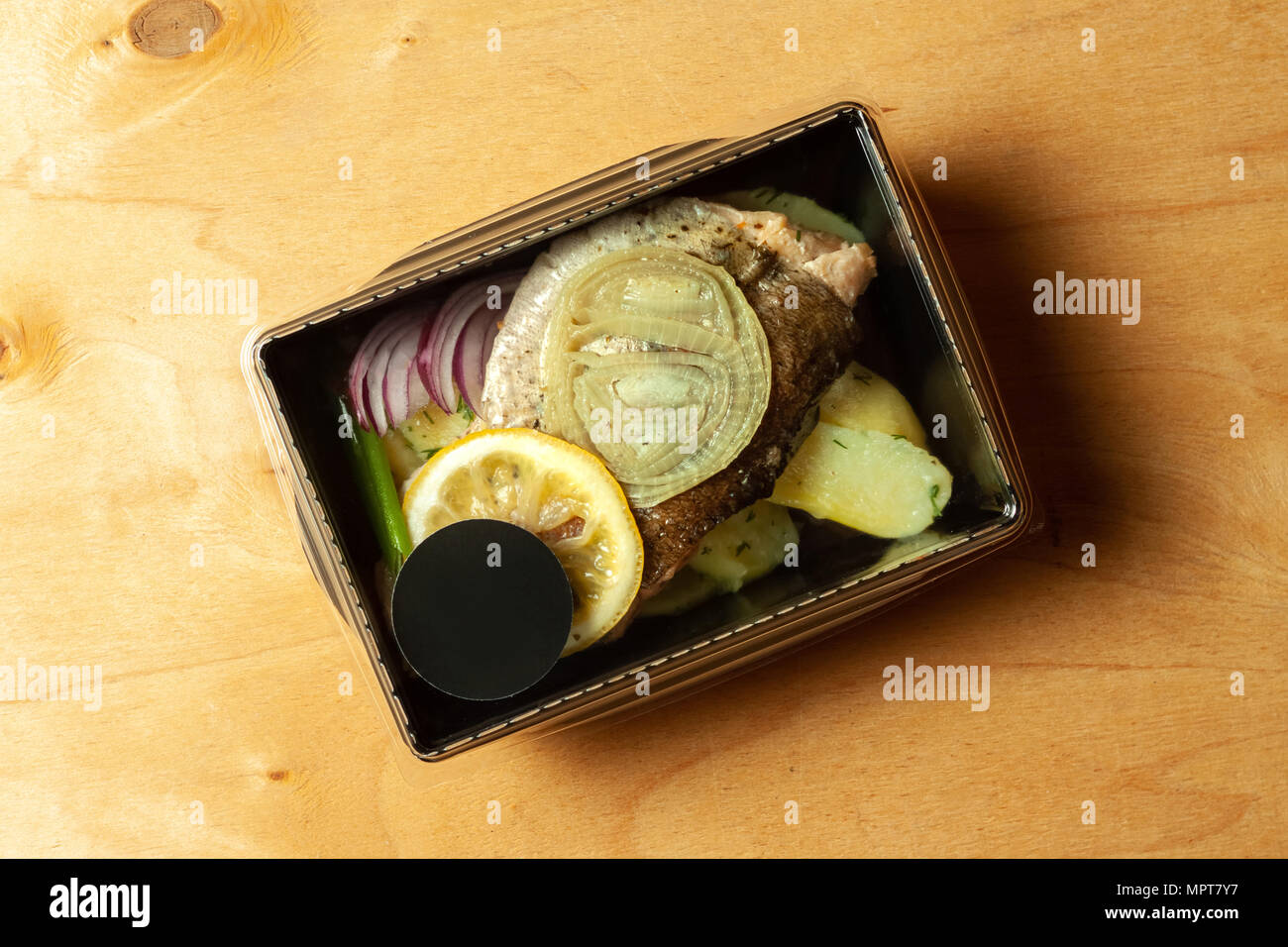 Fish fillet with vegetables and spices in a cardboard box Stock Photo ...