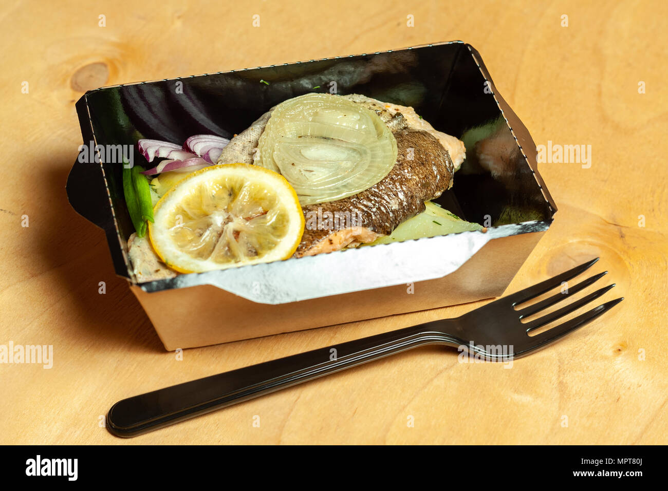 Fish fillet with vegetables and spices in a cardboard box Stock Photo ...