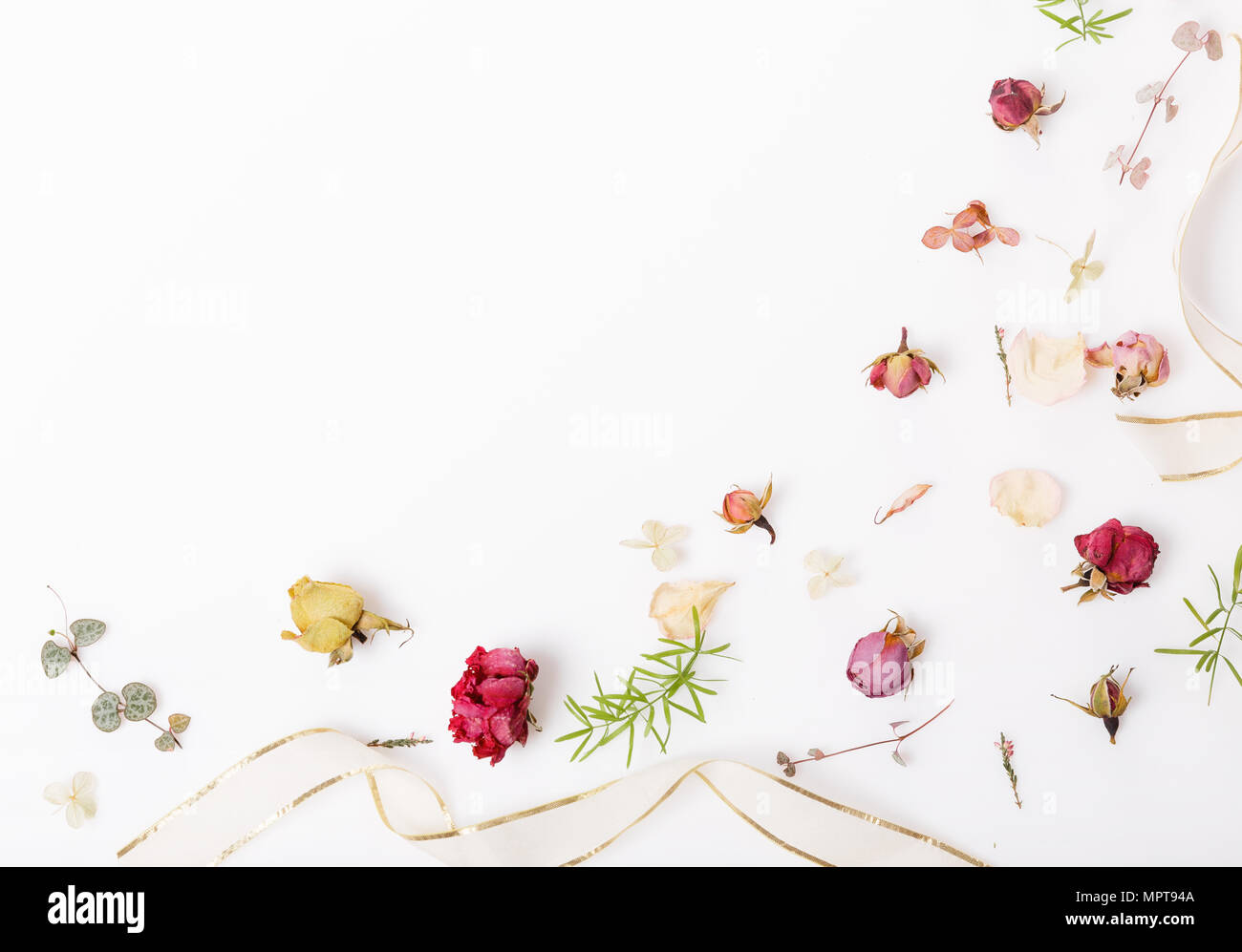 Festive flower composition on the white wooden background. Overhead ...