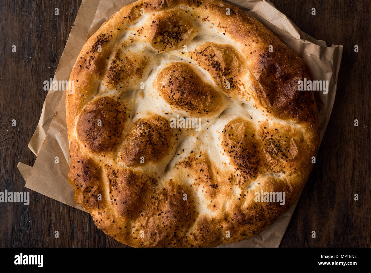 Turkish Ramadan Bread - Ramazan Pidesi on wooden surface / Pide ...