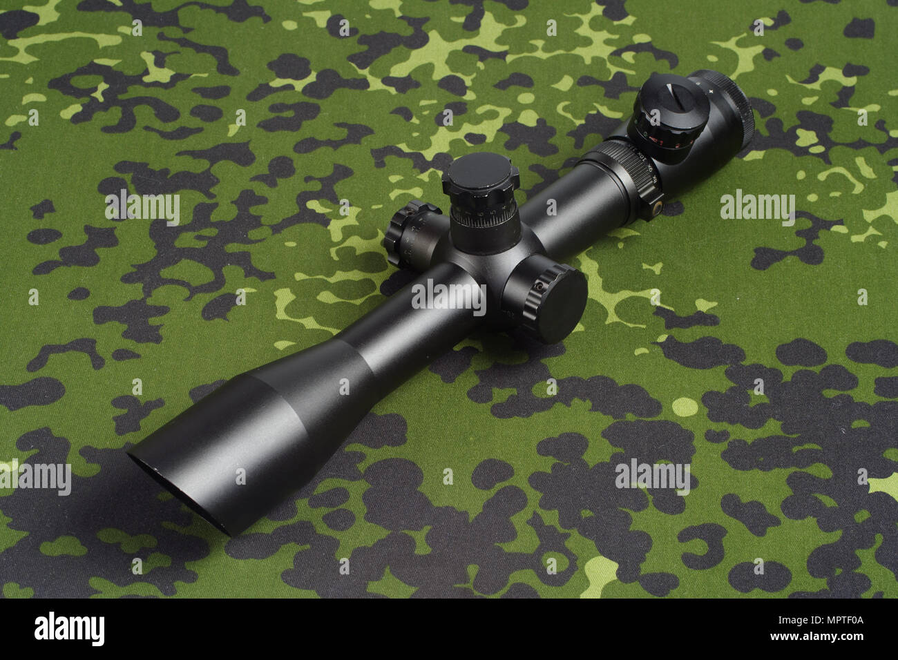 sniper scope on camouflage background Stock Photo - Alamy