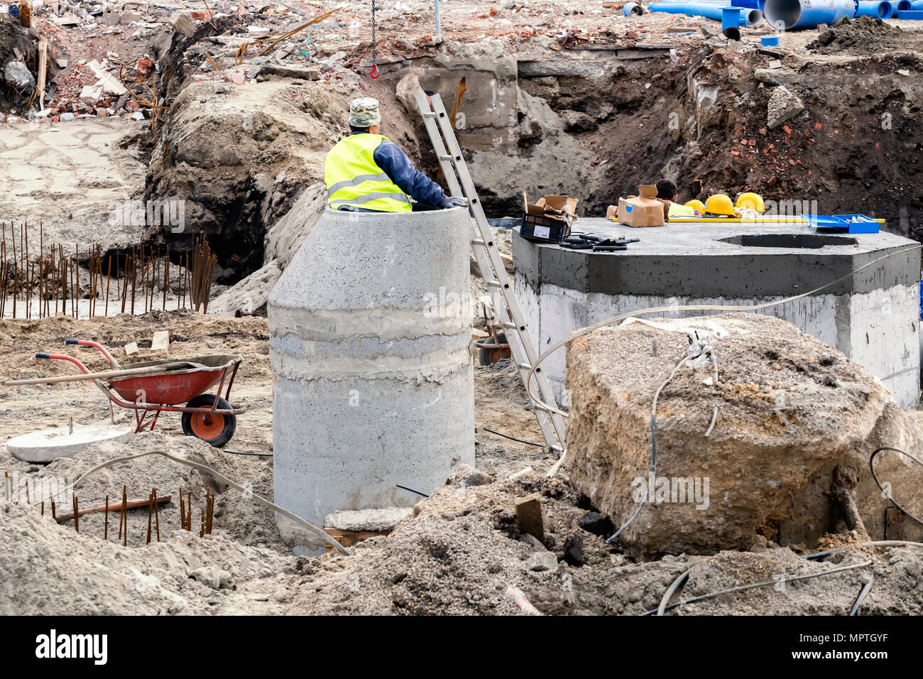 Sanitary sewer installation during rebuilding the street Stock Photo ...