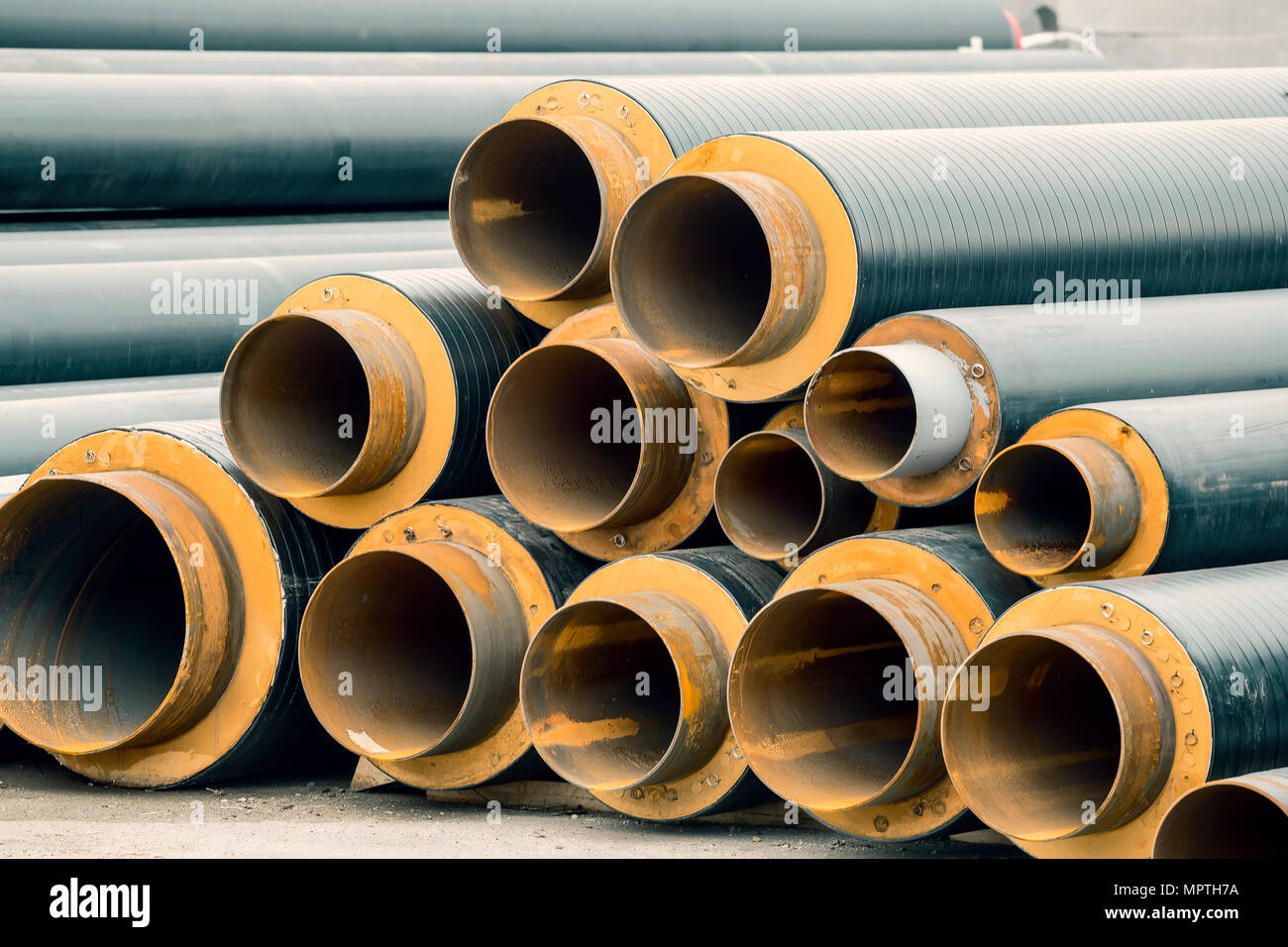 Staked insulated pipes for district heating, to connect a new building to heat system Stock ...