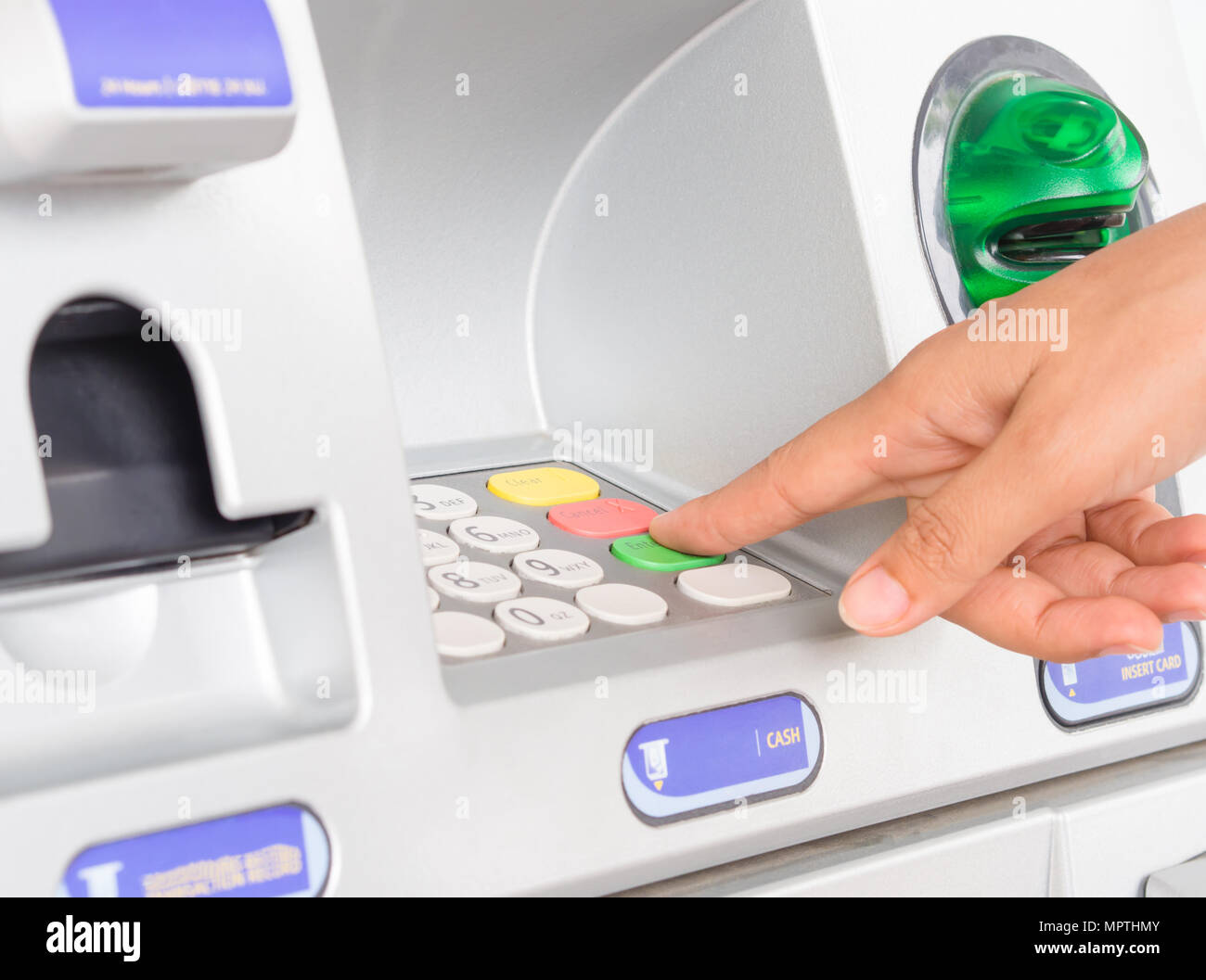 Close-up of woman's hand inserting debit card into an ATM machine Stock ...