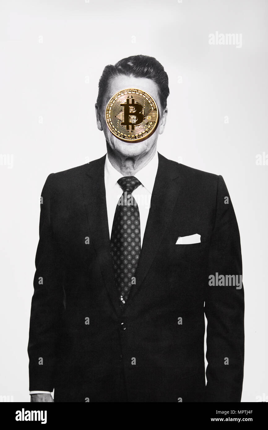 A Physical Bitcoin sits on a photo of a man in a suit. Concepts of ...