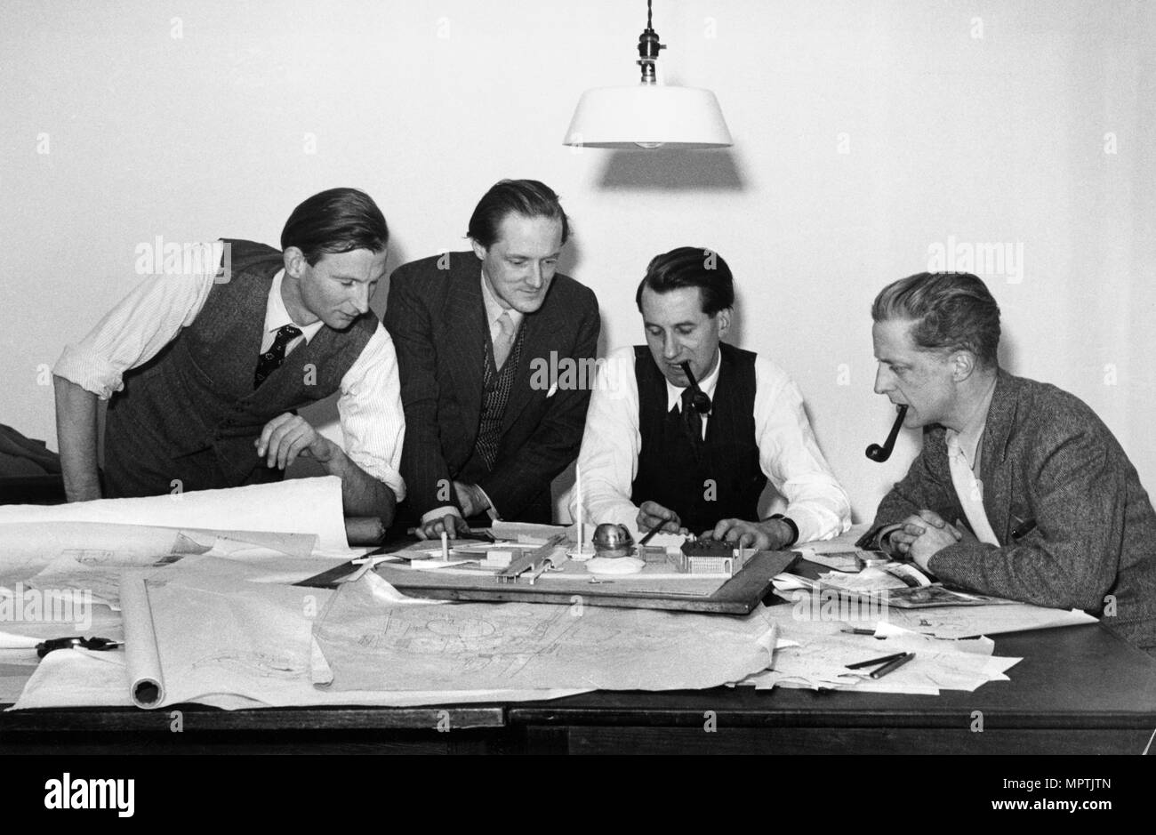 Architects and designers discussing the plans for the Festival of ...