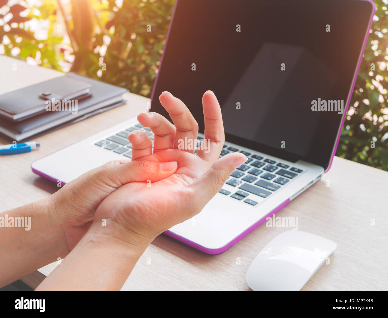 Closeup woman holding her painful hand from using computer. Office ...