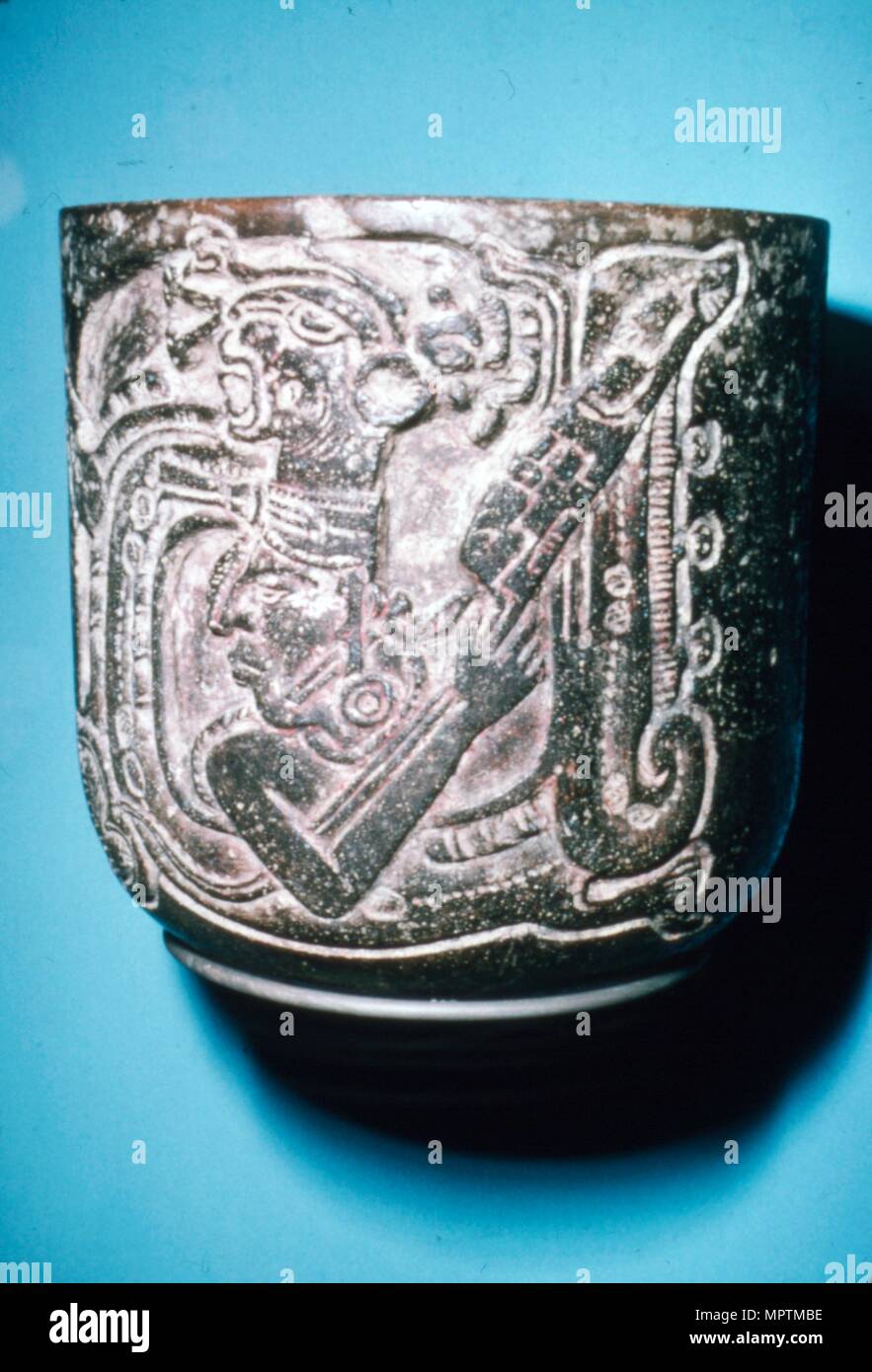 Mayan Pot of Man in high animal head-dress holding staff with lotus ...