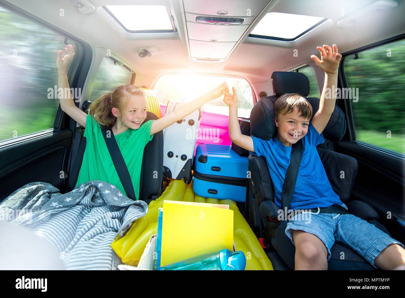 Holidays - Children relax in the car during a long car journey Stock ...