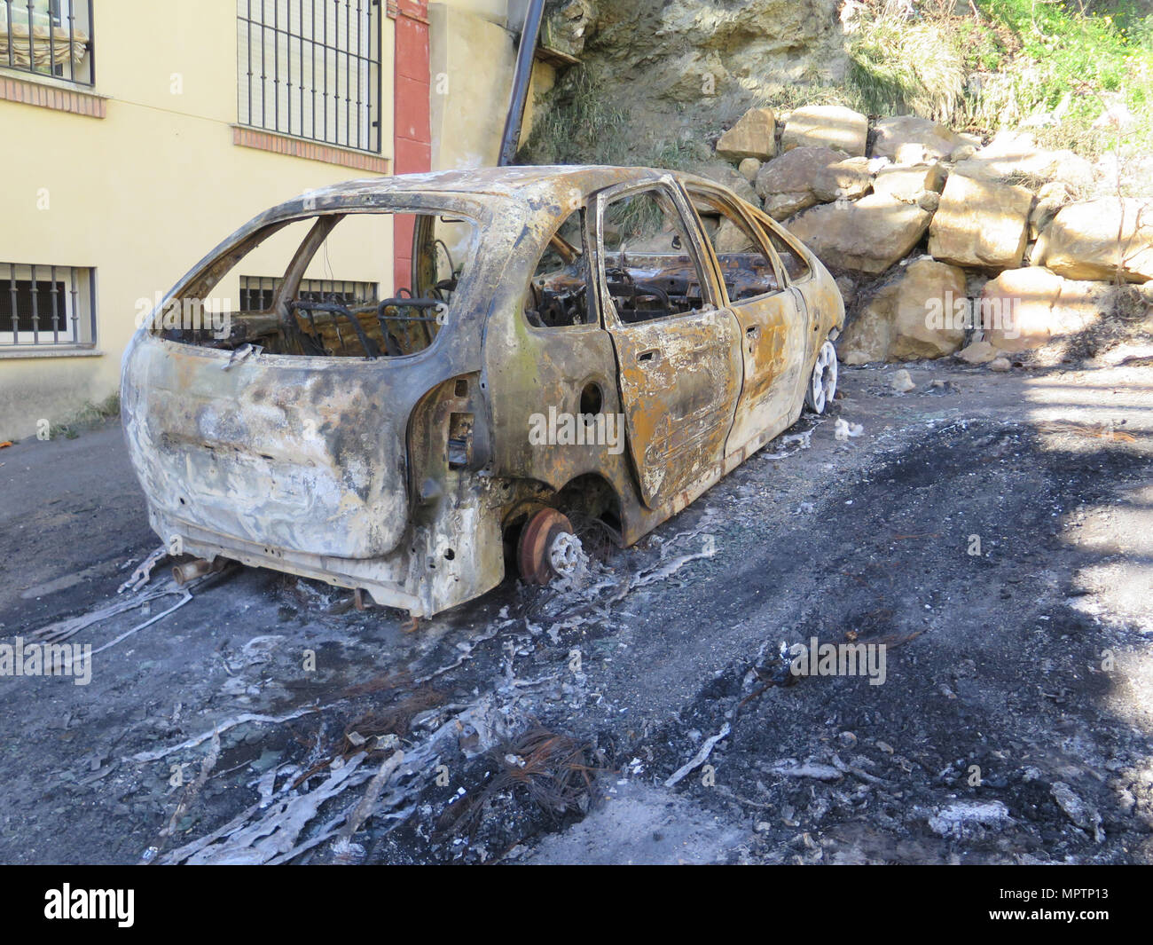 Leftover of Burned out car in residential area of Alora, Andalusia ...