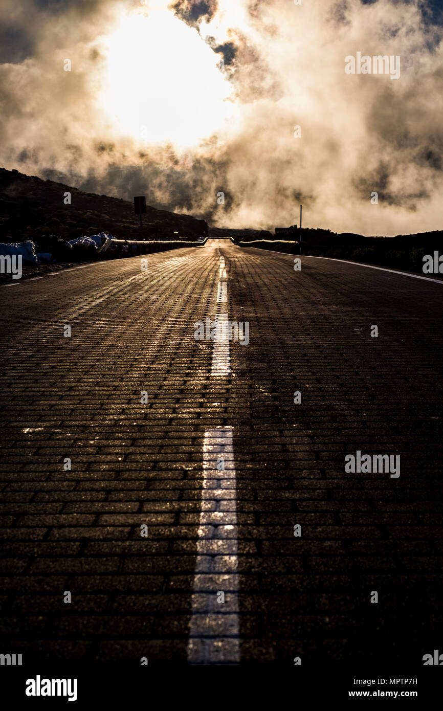 horror scared scene with dark straight road and clouds like a fire ...