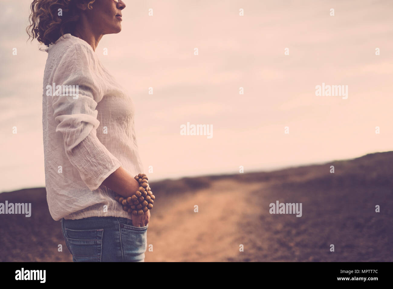beautiful middle age caucasian woman stand up near the desert Stock ...