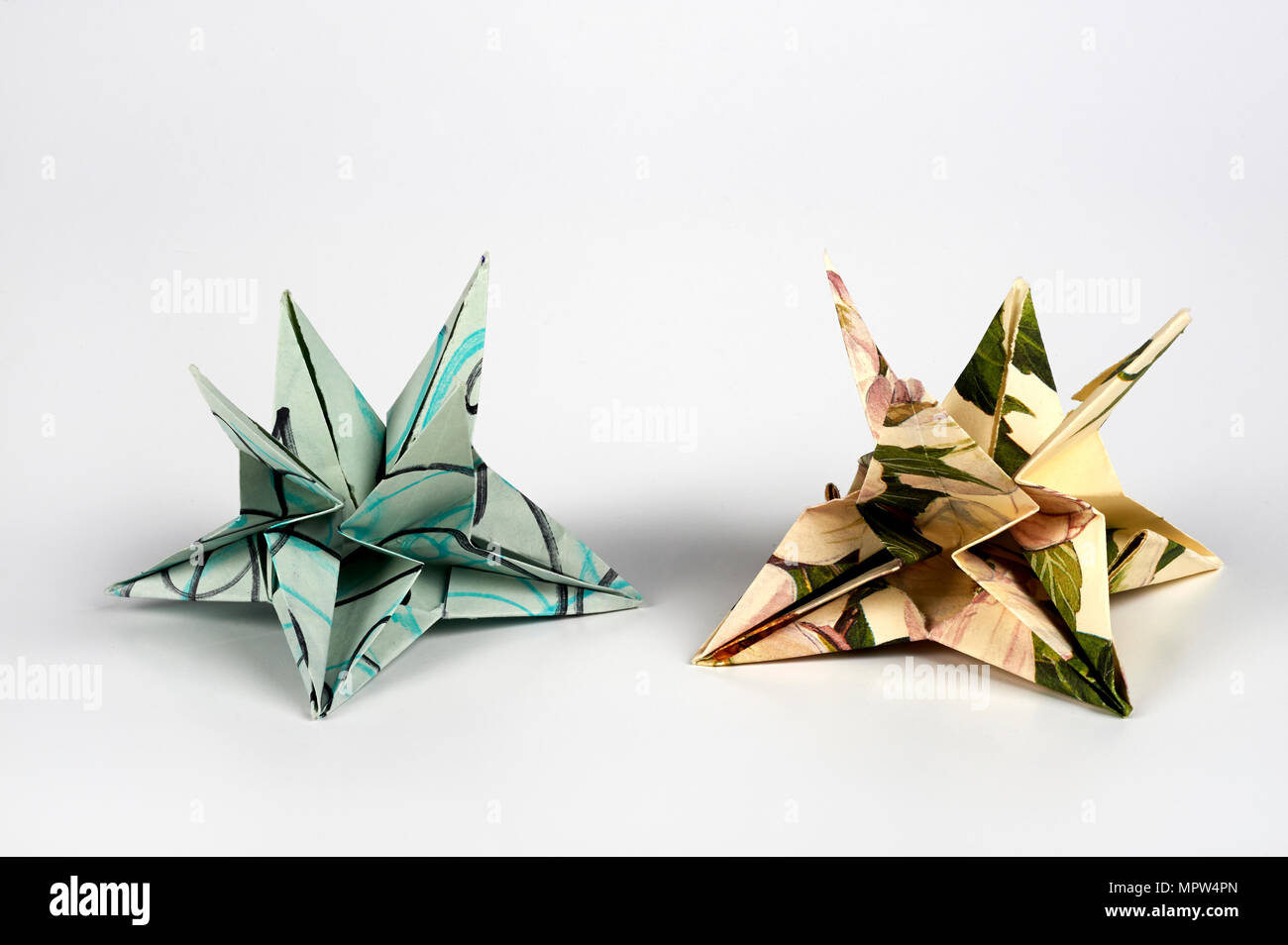 two paper origami on white background Stock Photo - Alamy