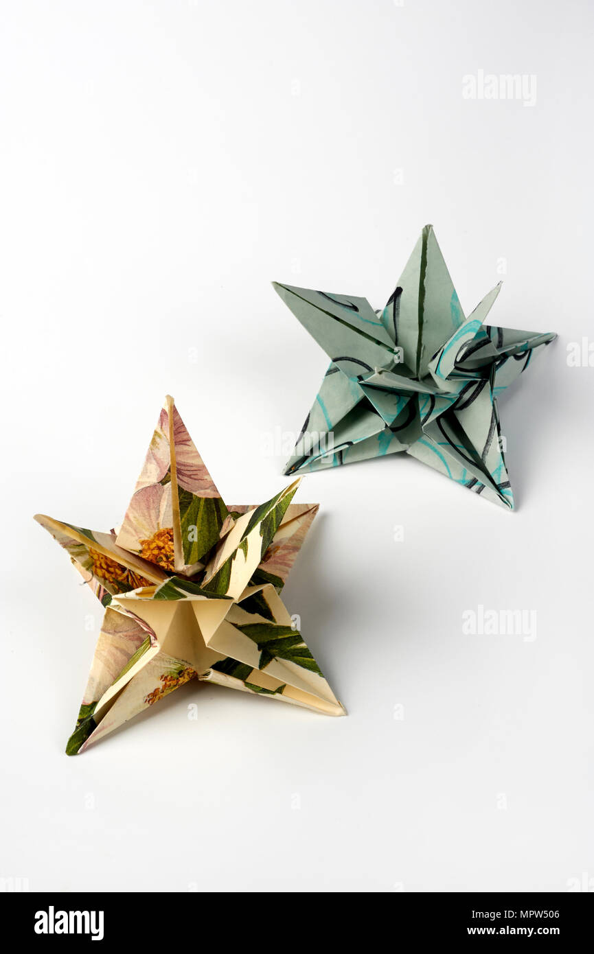 two paper origami on white background Stock Photo - Alamy
