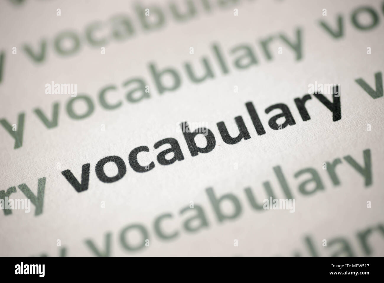 word language printed on white paper macro Stock Photo - Alamy