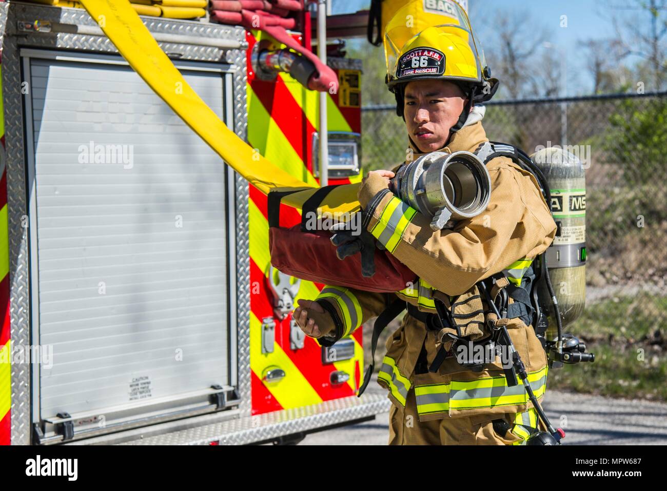 Firefighters with the 375th Civil Engineer Squadron perform drills in ...