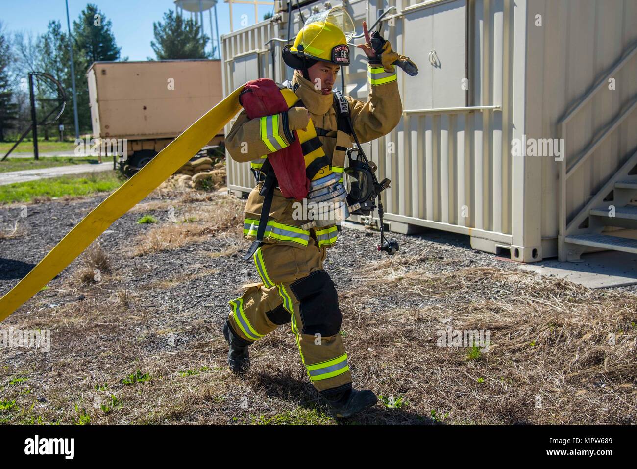 Firefighters with the 375th Civil Engineer Squadron perform drills in ...