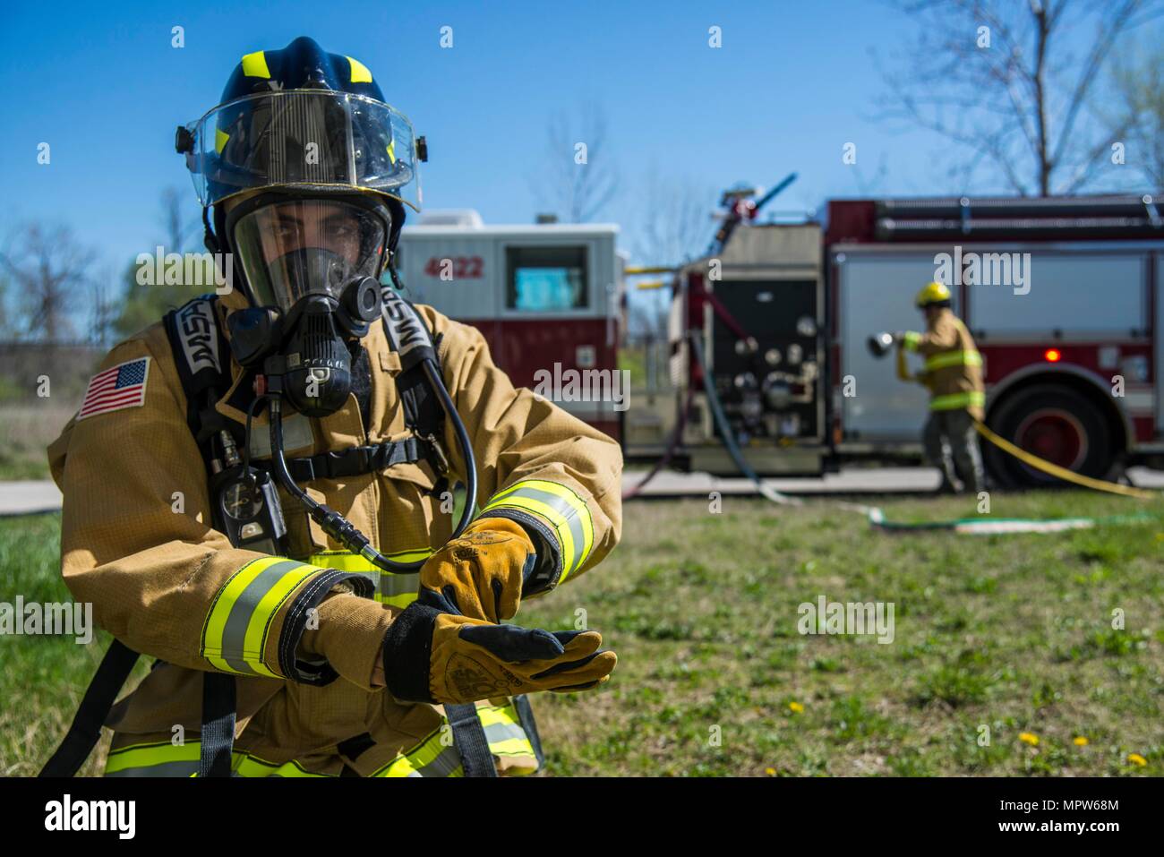 Firefighters with the 375th Civil Engineer Squadron perform drills in ...