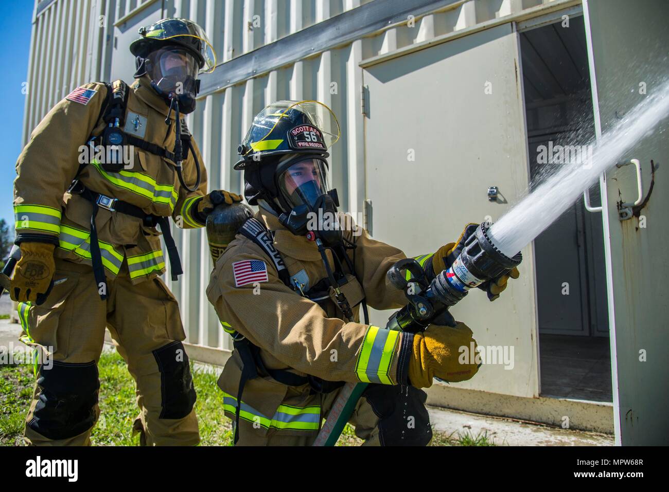 Firefighters with the 375th Civil Engineer Squadron perform drills in ...