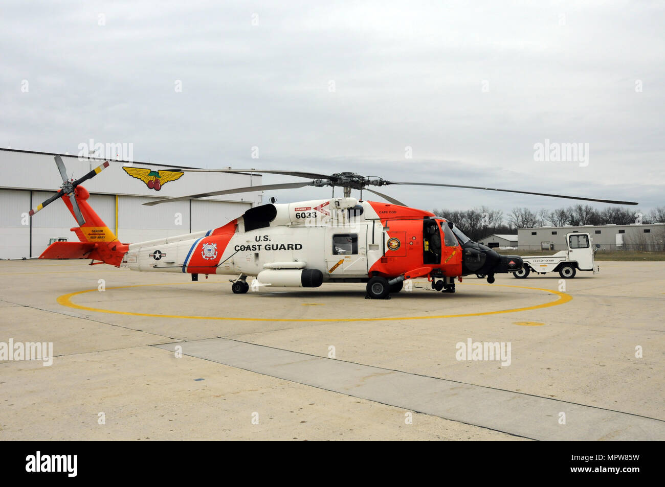 An MH-60T Jayhawk helicopter sits on the tarmac at Air Station Traverse ...