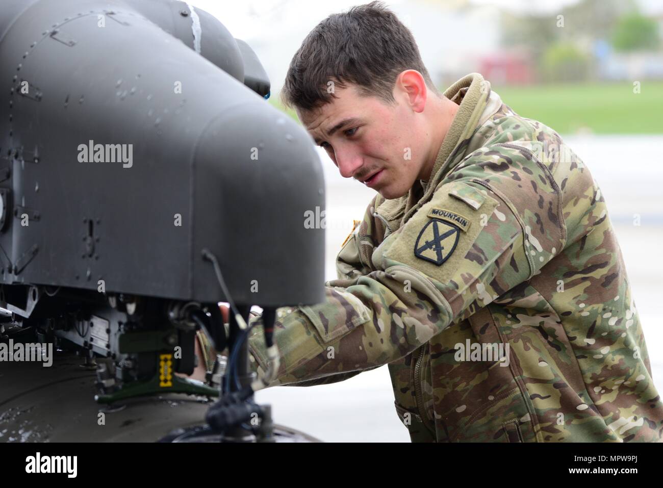 U.S. Army Spc. Daniel Struxness, a UH-60 Black Hawk crew chief (15T ...