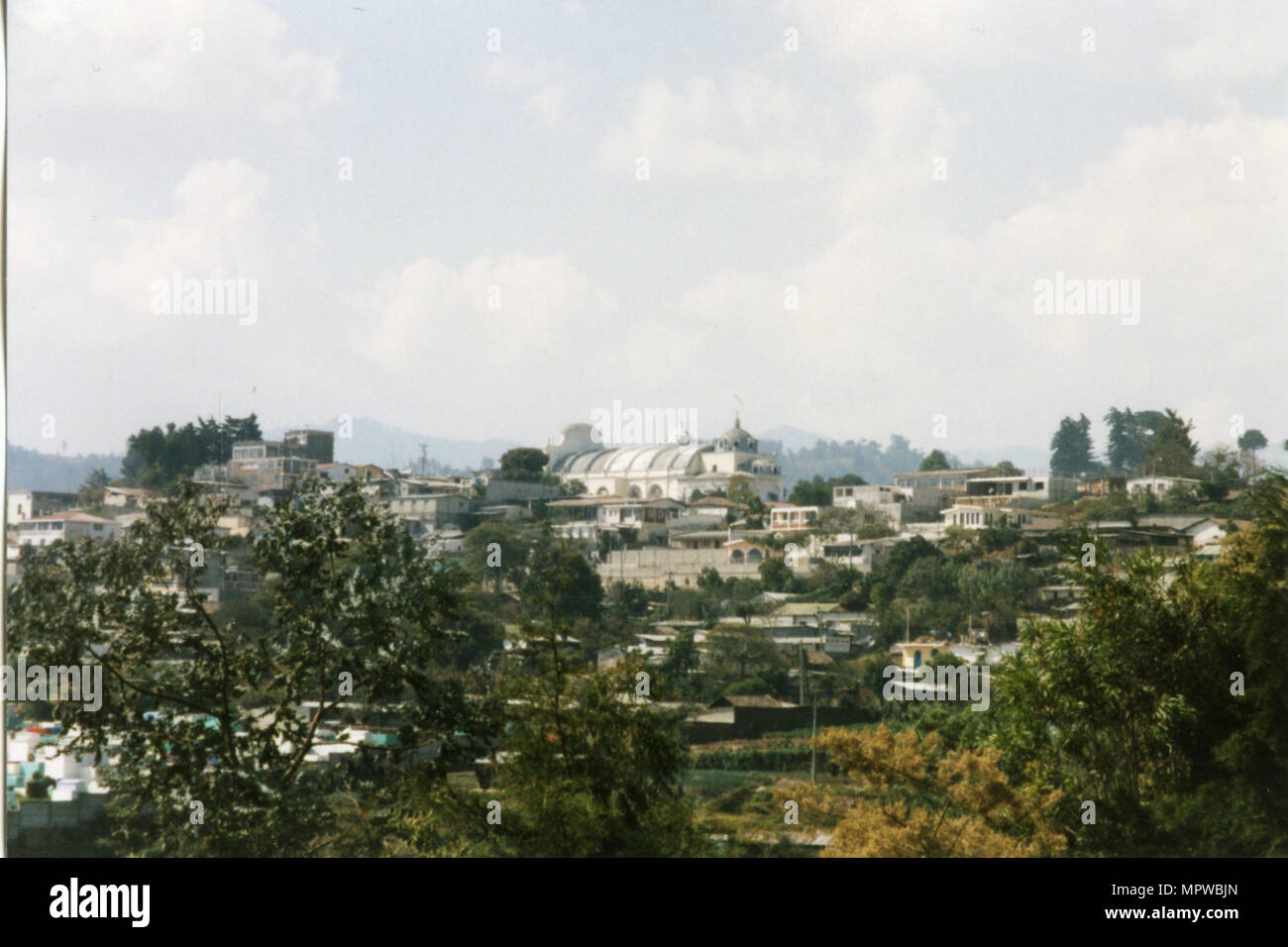 A skyline view of an Indonesian city in 1999 shows urban development ...
