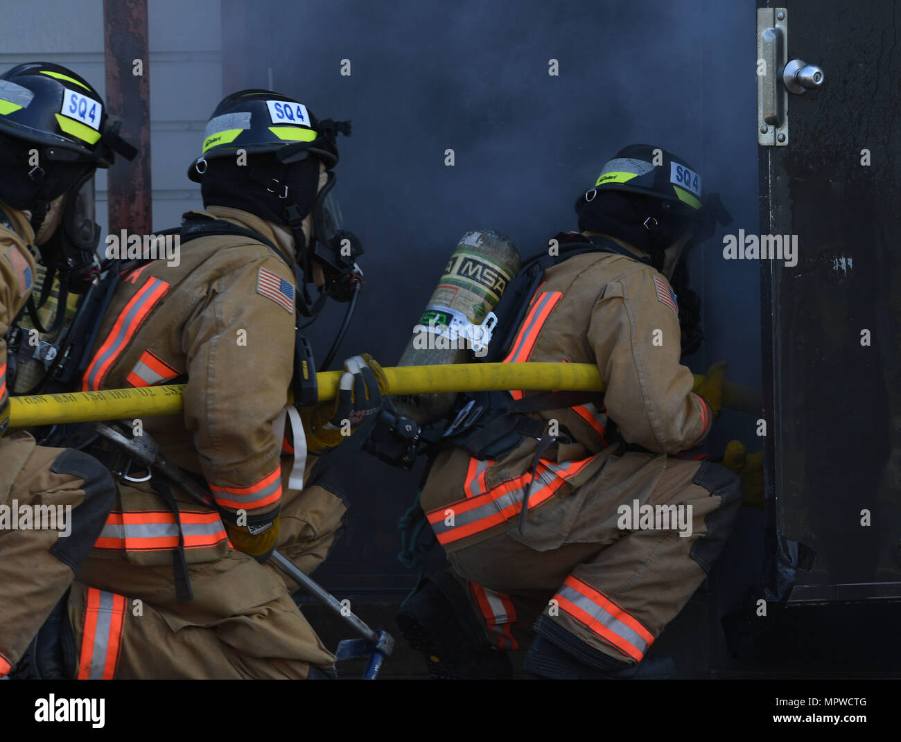 PORTSMOUTH, Va. (APRIL 14, 2017) Navy Sailors enter a burning building ...