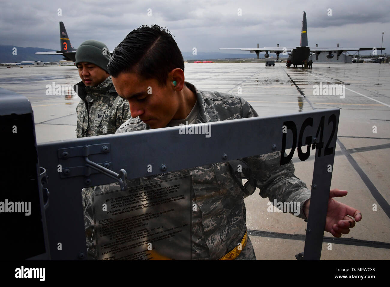 U.S. Air National Guard members Senior Airman Santos Casaus and Staff ...