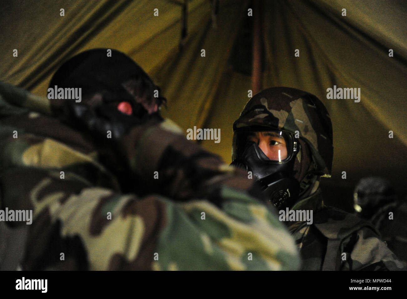 Airmen stationed at Hickam Field check each other's Mission Oriented ...