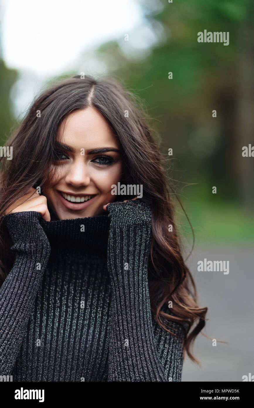 Outdoor portrait of young pretty beautiful calm woman Stock Photo - Alamy