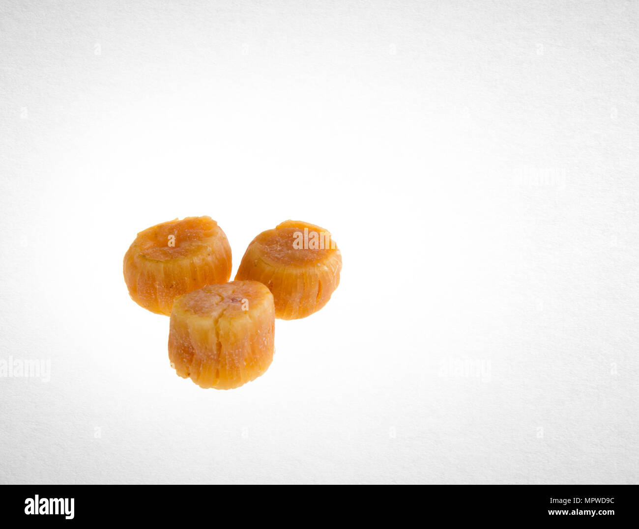 scallop or dried scallop on a background Stock Photo - Alamy
