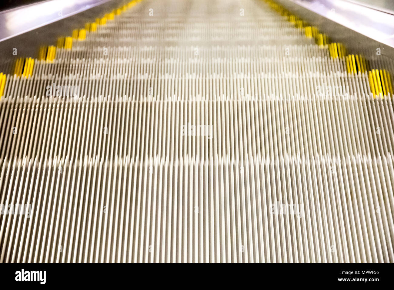Empty metal escalator in perspective close-up Stock Photo - Alamy