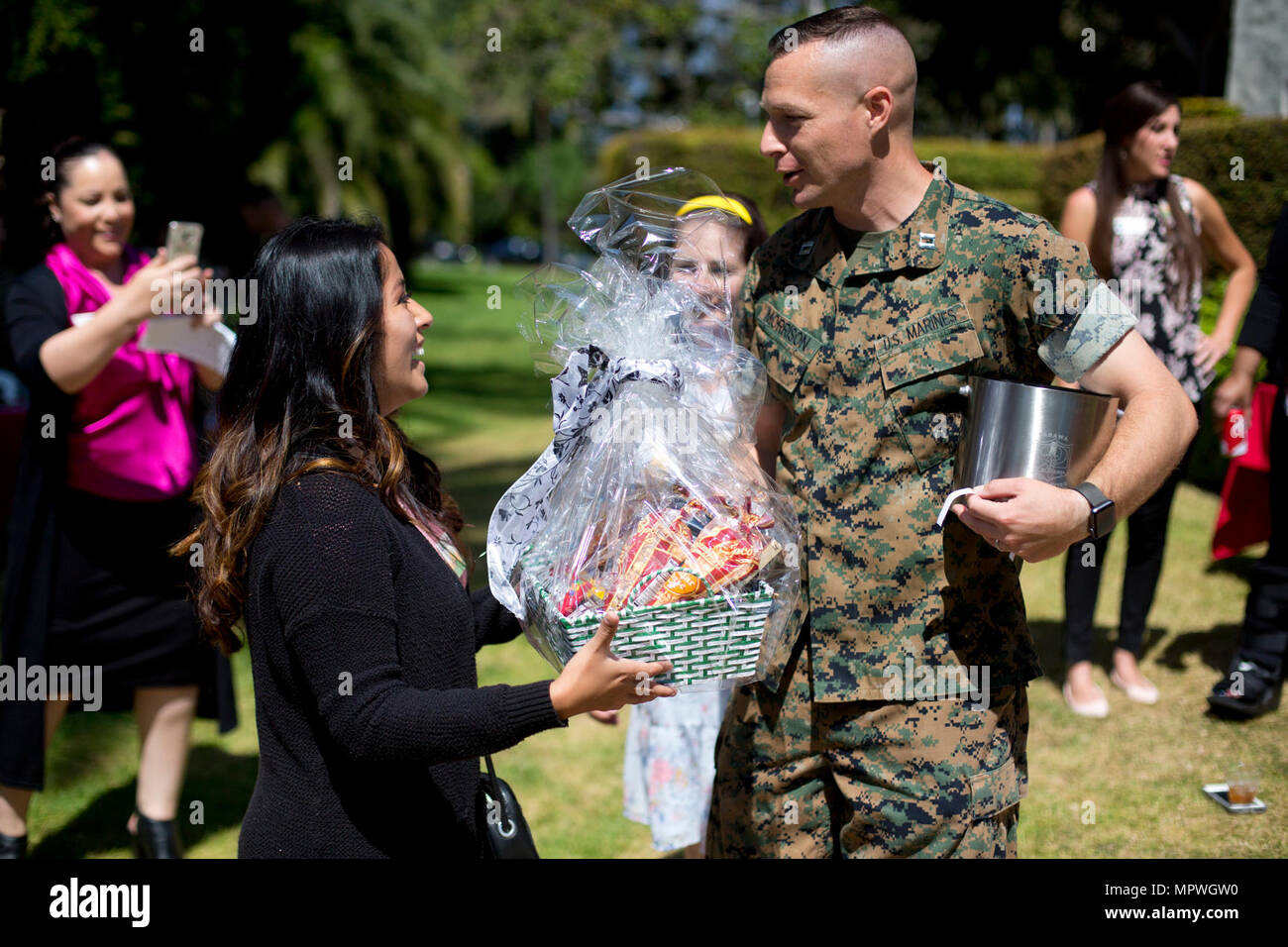 U.S. Marine Corps Capt. William C. Morrison, right, protocol officer ...