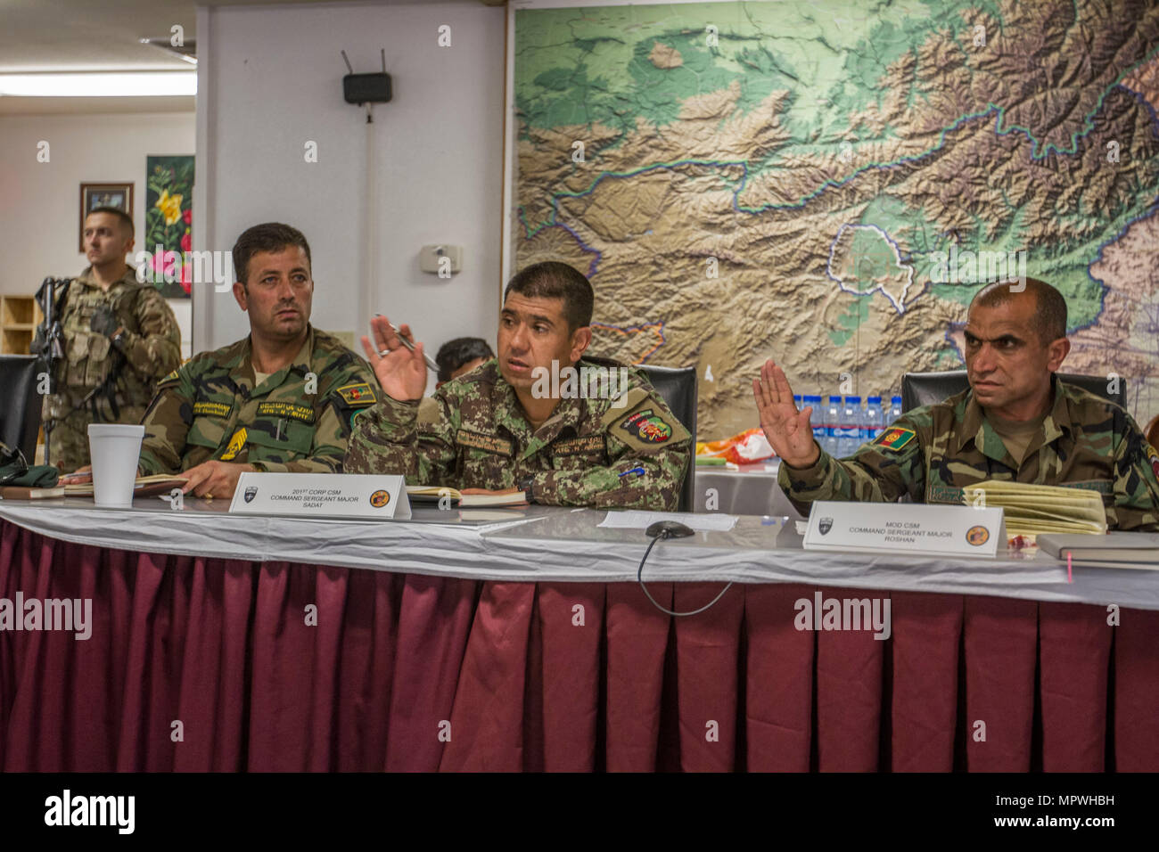 Afghan National Army command Sgt. Maj. Safi Roshan listens to issues ...