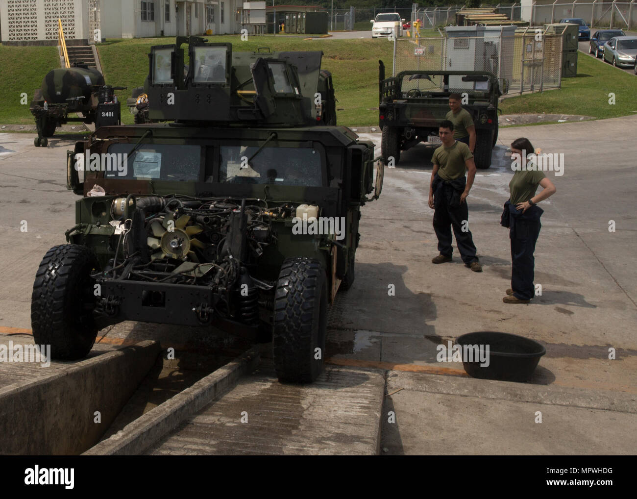 Marines with the 31st Marine Expeditionary Unit clean a Humvee at Camp ...