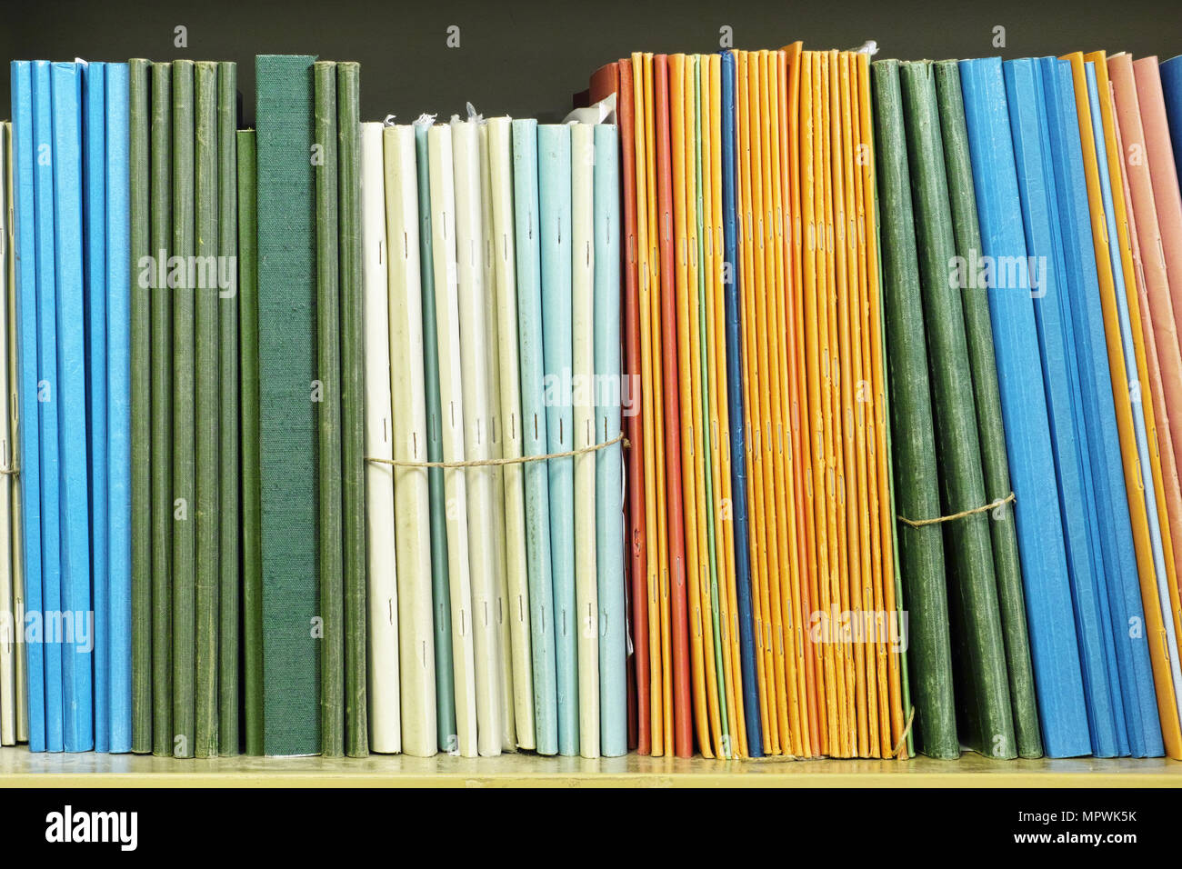 documents aligned on the shelf of a bookcase Stock Photo - Alamy