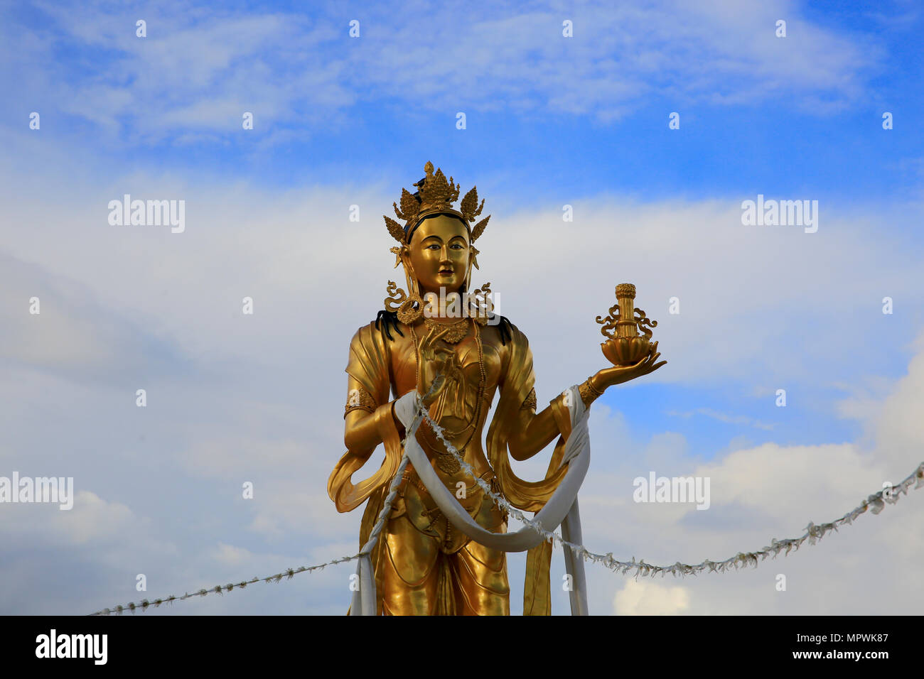 Golden statue of Buddhist female god on the Buddha Dordenma temple ...