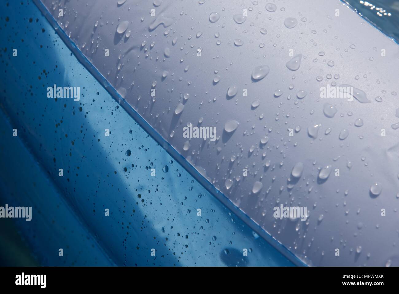 Inflatable paddling pool: beads of water on an inflatable paddling pool ...