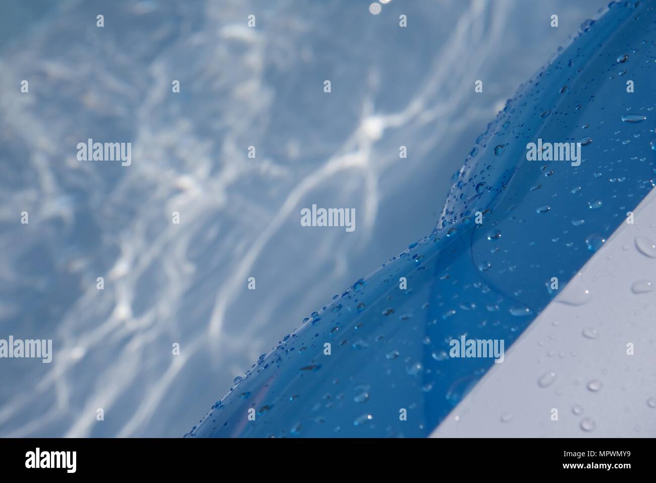 Inflatable paddling pool: beads of water on an inflatable paddling pool ...