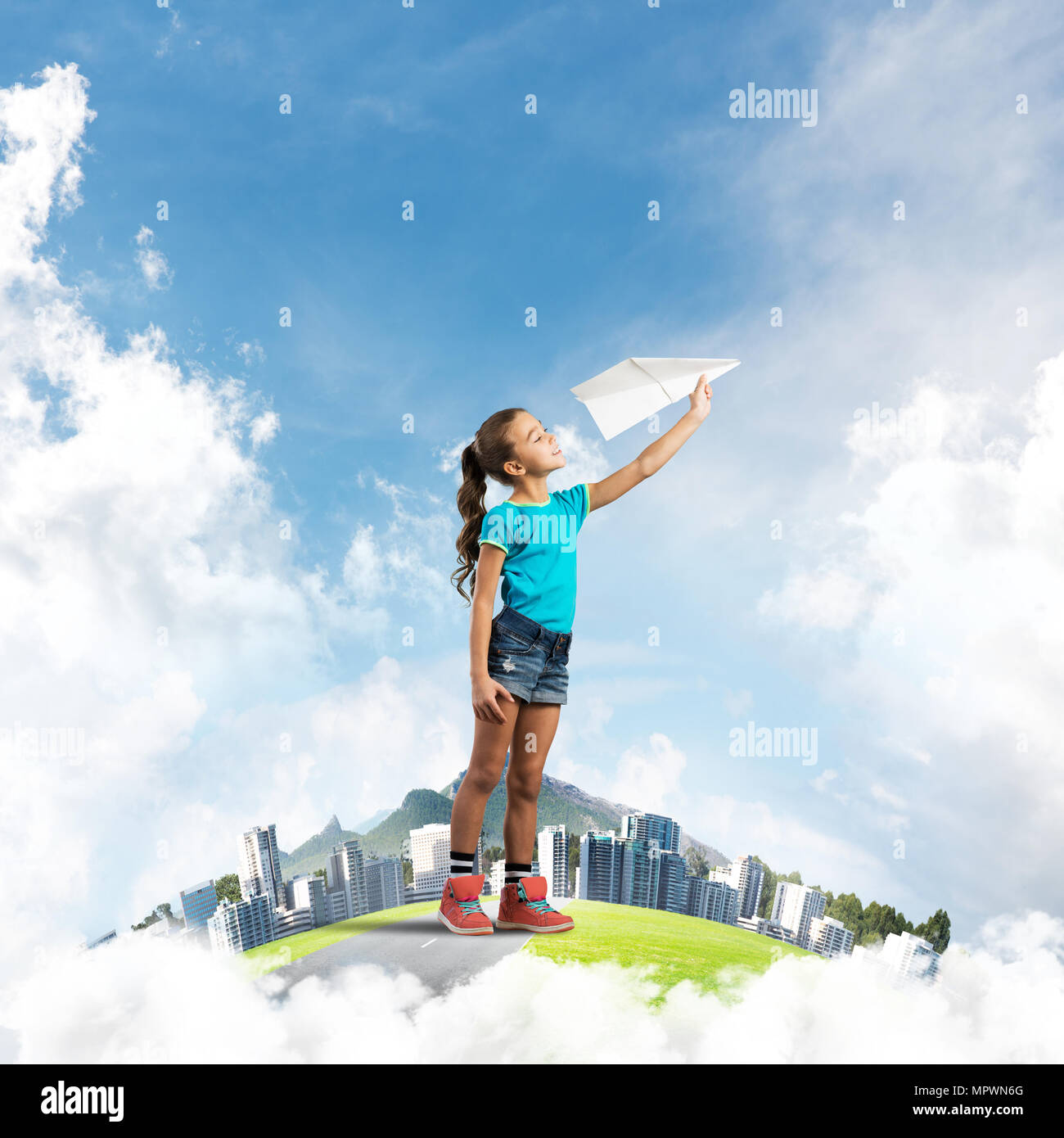 Concept of careless happy childhood with girl dreaming about future ...