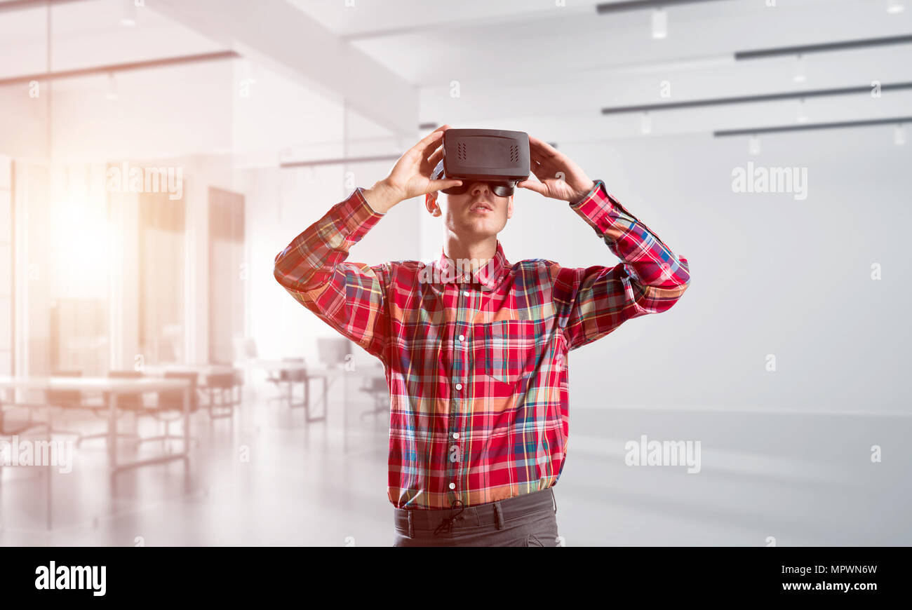 Concept of modern entertaining technologies with man wearing virtual ...