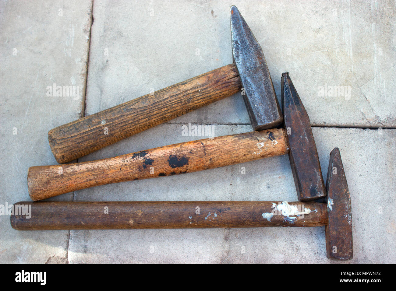 Old rusty tools must be replaced with new ones Stock Photo - Alamy