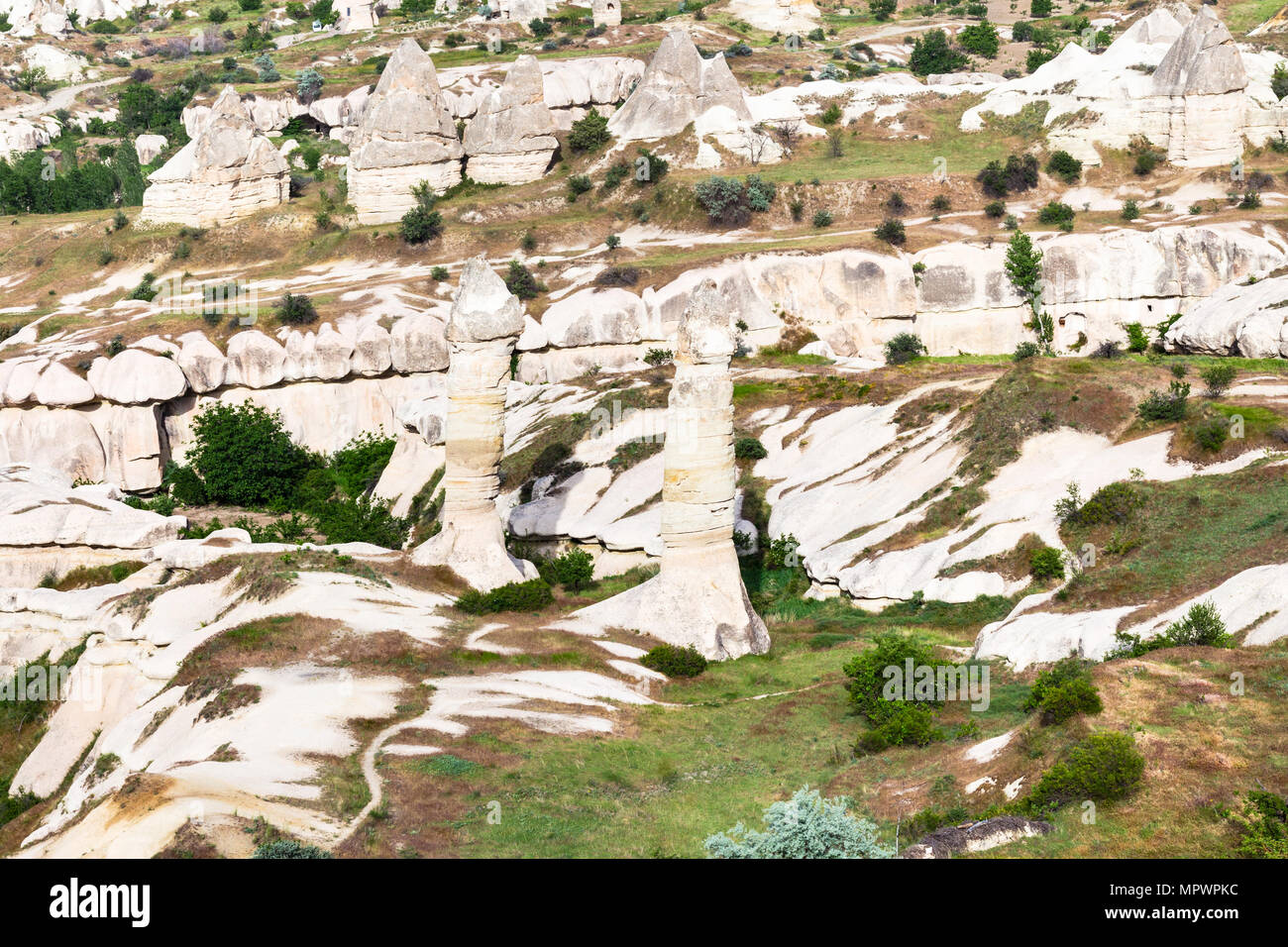 Travel to Turkey - above view of fairy chimney rocks on mountain slope ...
