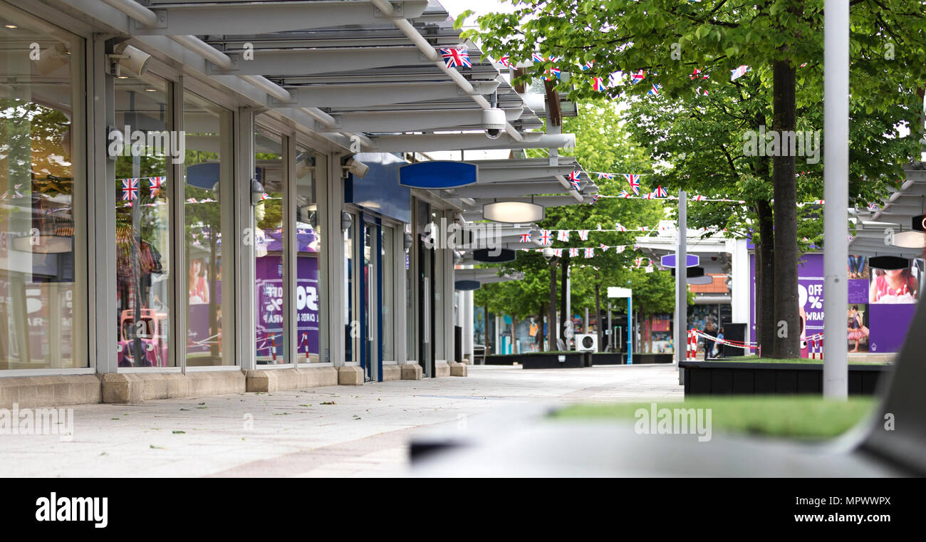 Empty and deserted shopping centre illustrating a decline in the high ...