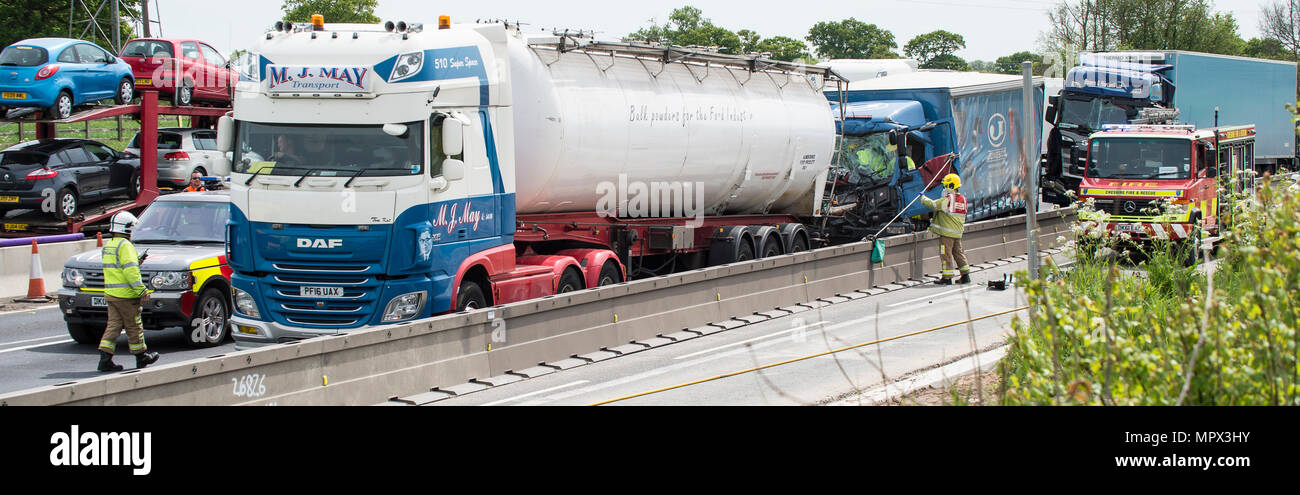 Four HGVs crash one man trapped fire service and ambulance crews trying to extracate him air ...