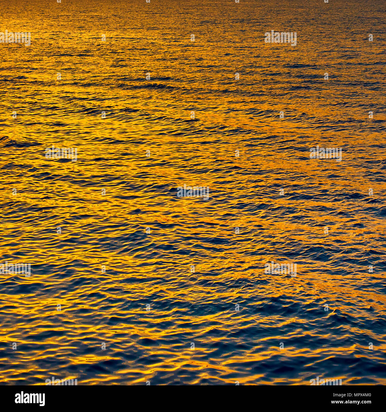 Gold sea water at sundown, may be used as background Stock Photo - Alamy